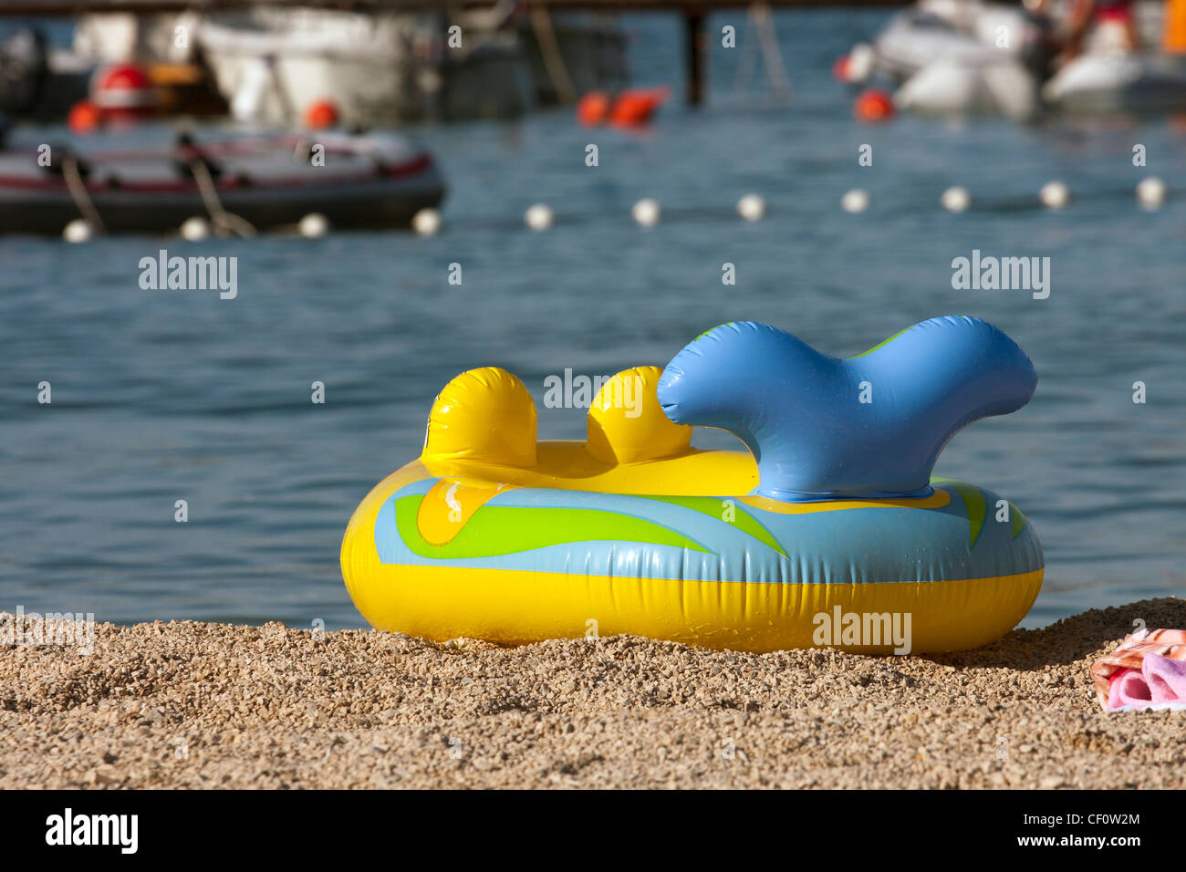 Kids buoy on the beach by the sea Stock Photo - Alamy