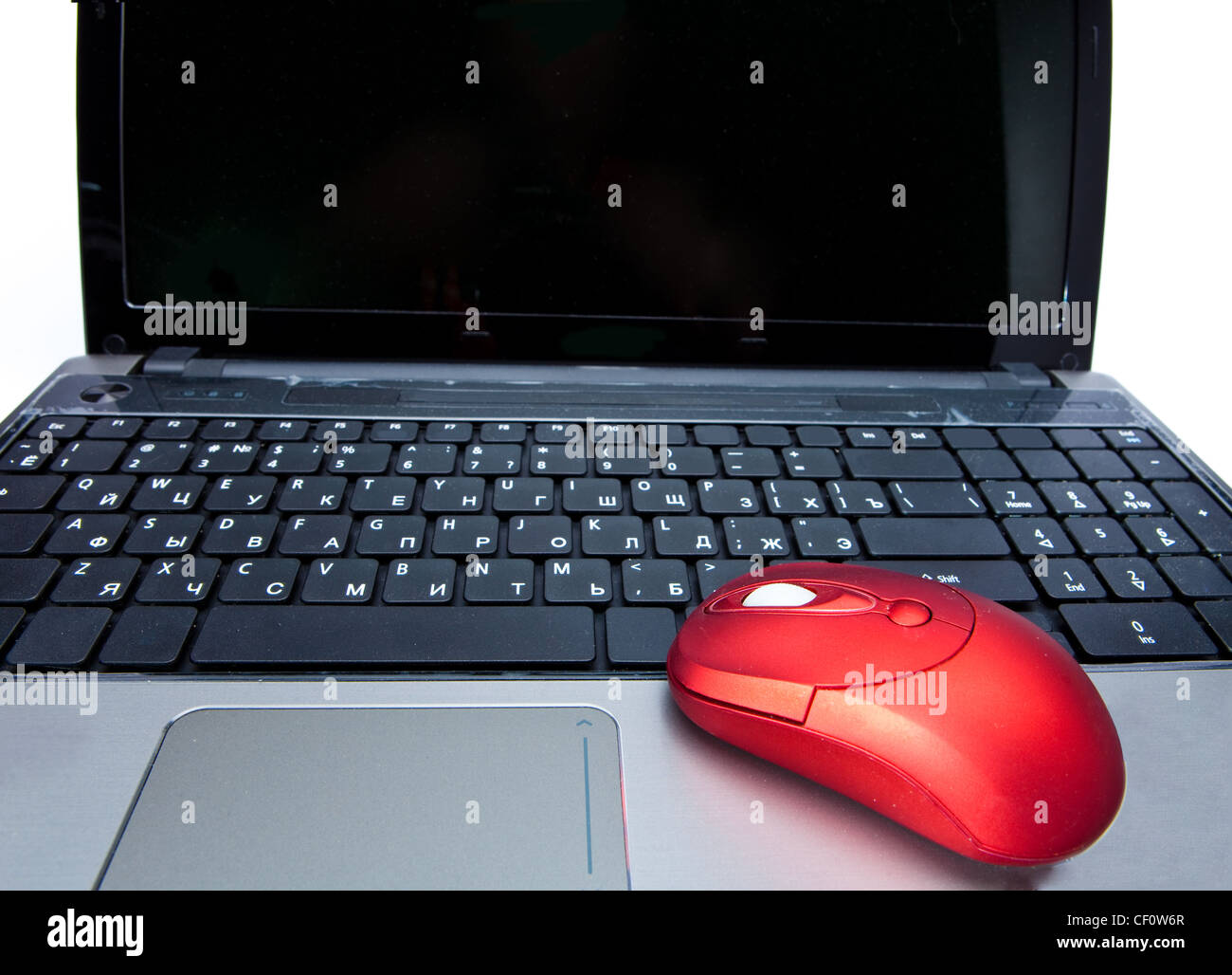 The red computer mouse on the black keyboard Stock Photo - Alamy