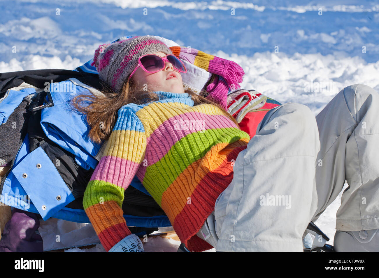Girl enjoying winter sun Stock Photo - Alamy
