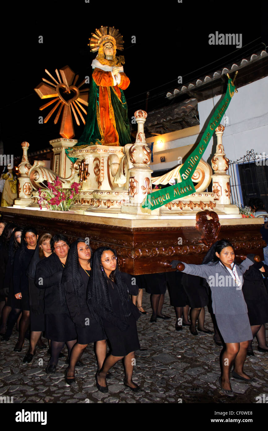 Virgin Mary procession, Las Dolorosas. Women carrying Virgin Mary ...