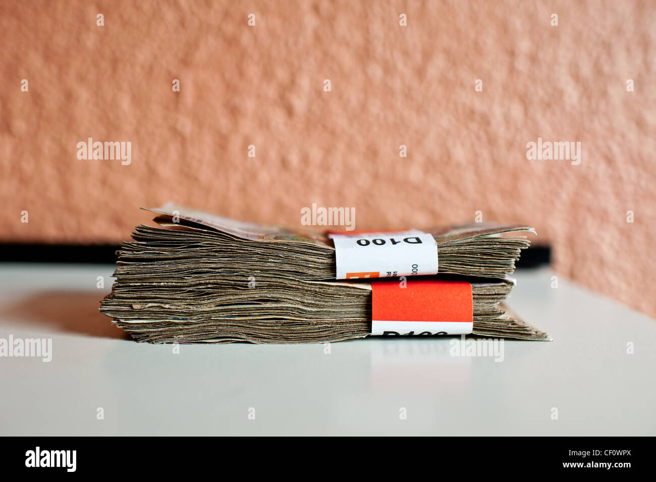 Money piled up hi-res stock photography and images - Alamy
