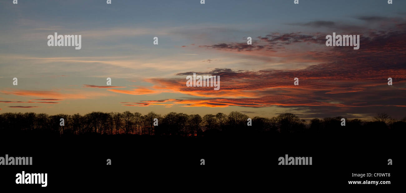 A dramatic sunset over countryside Stock Photo - Alamy