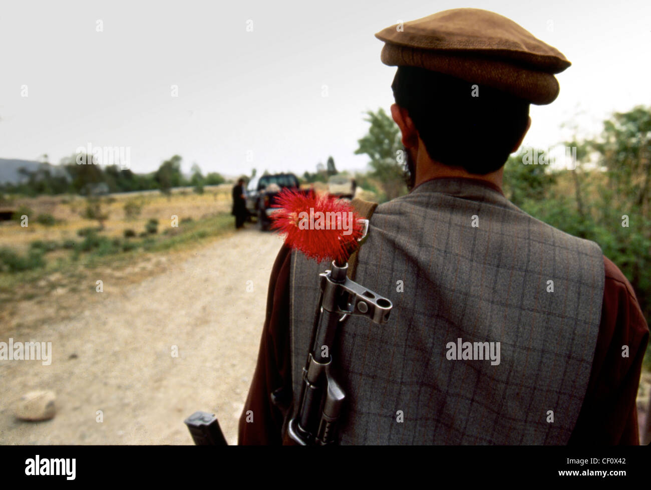 A Mujahedin warriors whit a flower in the Kalashnikov Stock Photo - Alamy