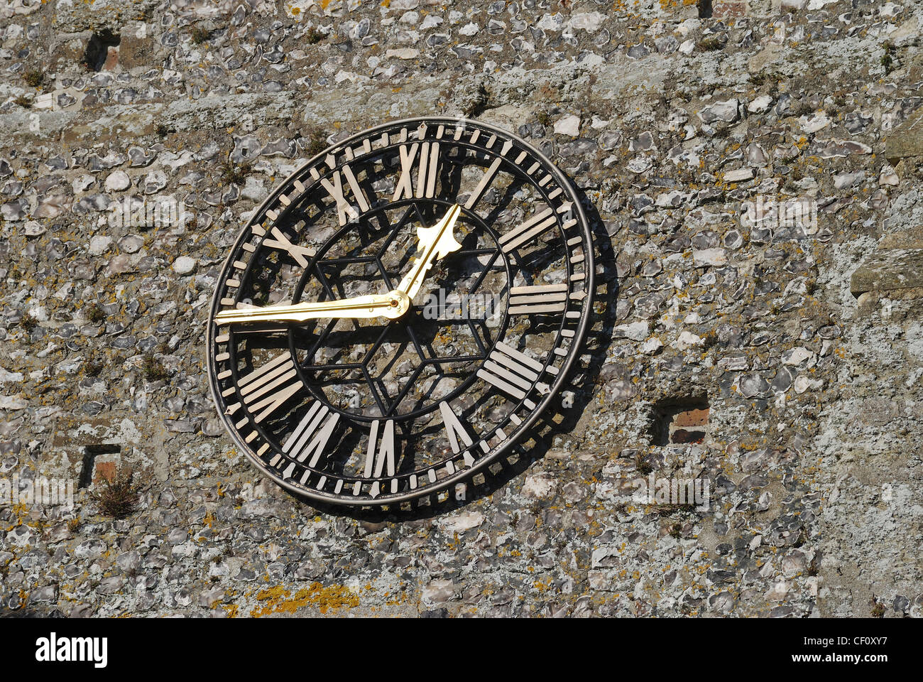 Clock on flintstone tower to Saint Mary the Virgin Church at Burpham ...