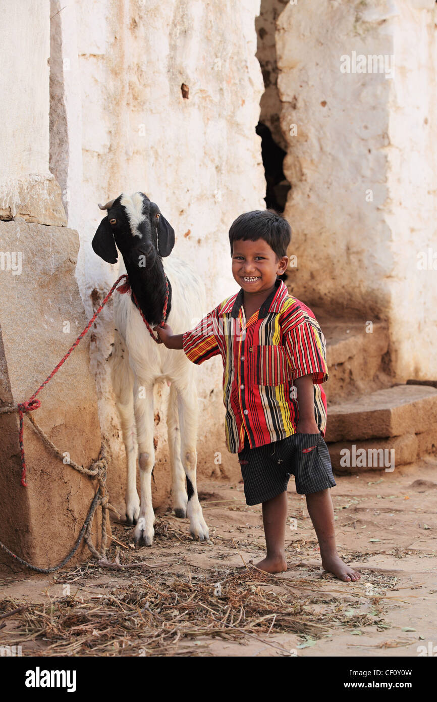 Boy with goat india hi-res stock photography and images - Alamy