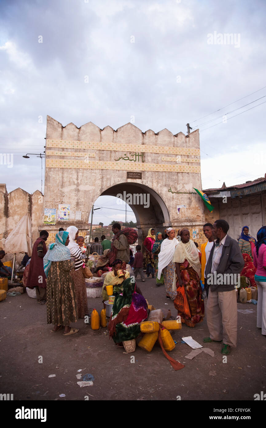 Africa, Ethiopia, Harar, People lingering and trading outside Asmadin ...