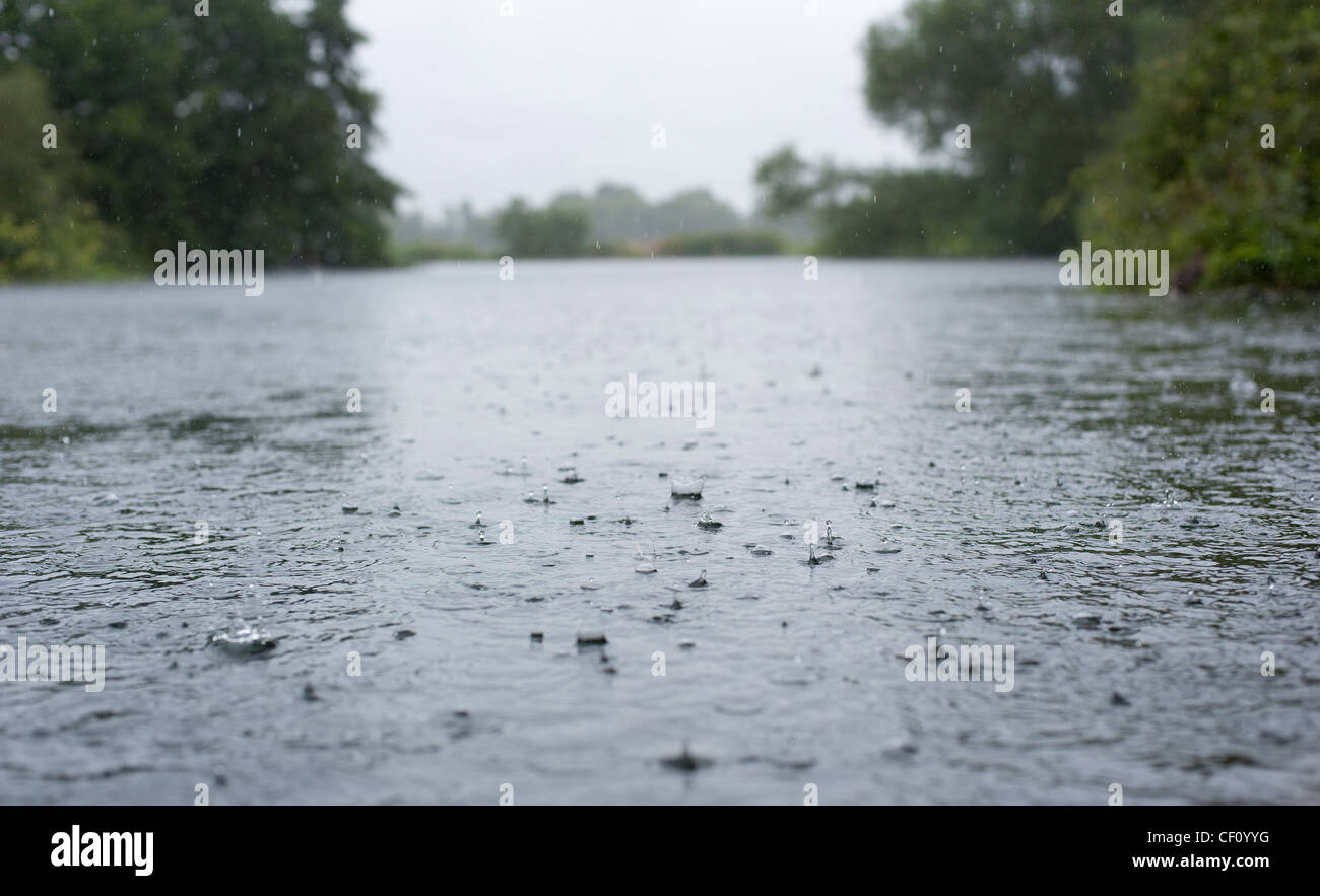 raindrops splashing on river Stock Photo - Alamy