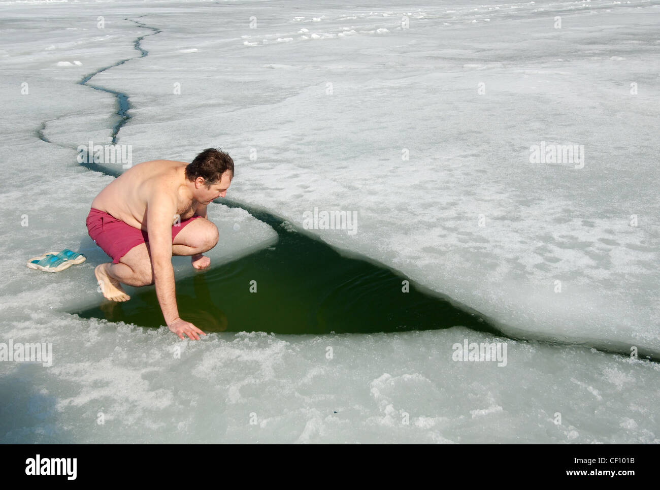 Man swimming in the ice hole, Odessa, Ukraine, Eastern Europe, Europe ...