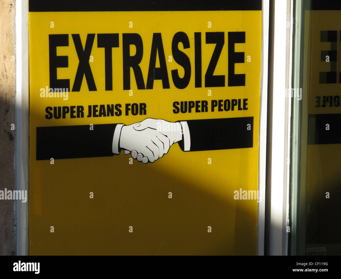 over size clothes shop sign notice in rome italy Stock Photo - Alamy