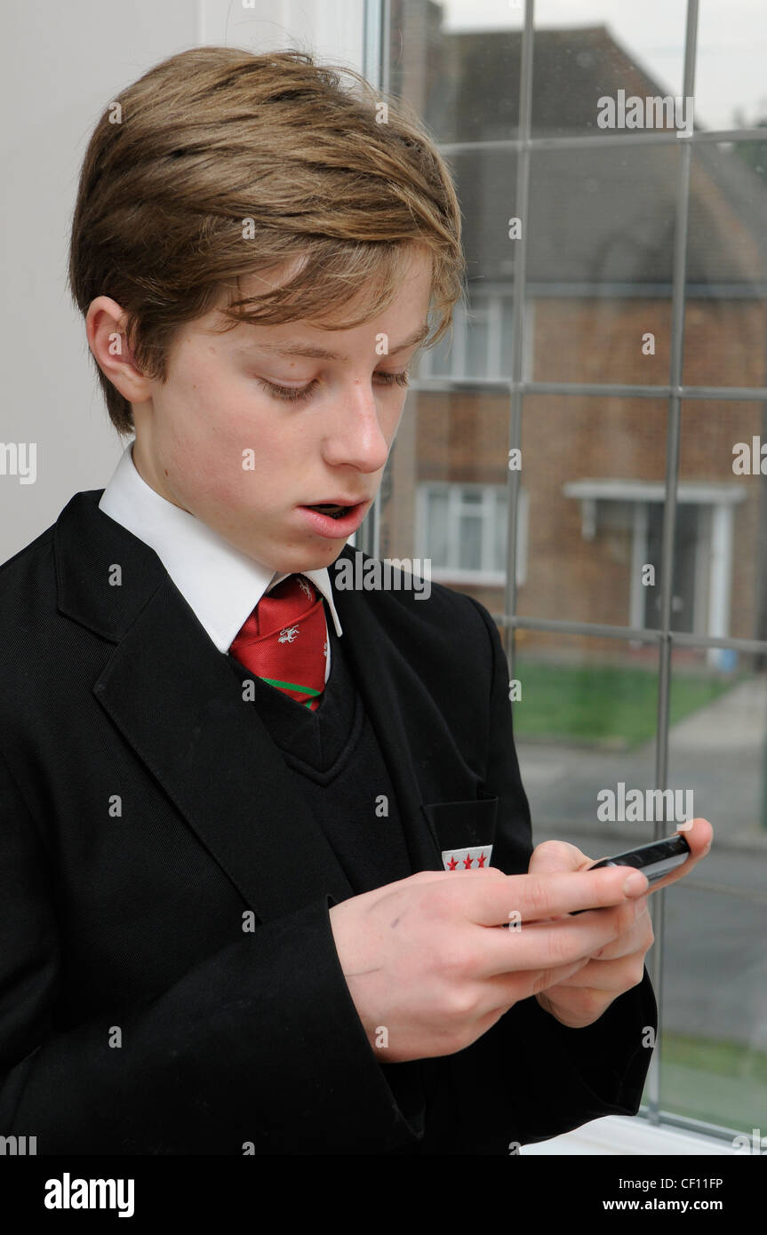 Teenage Boy Using A Mobile Phone Stock Photo - Alamy