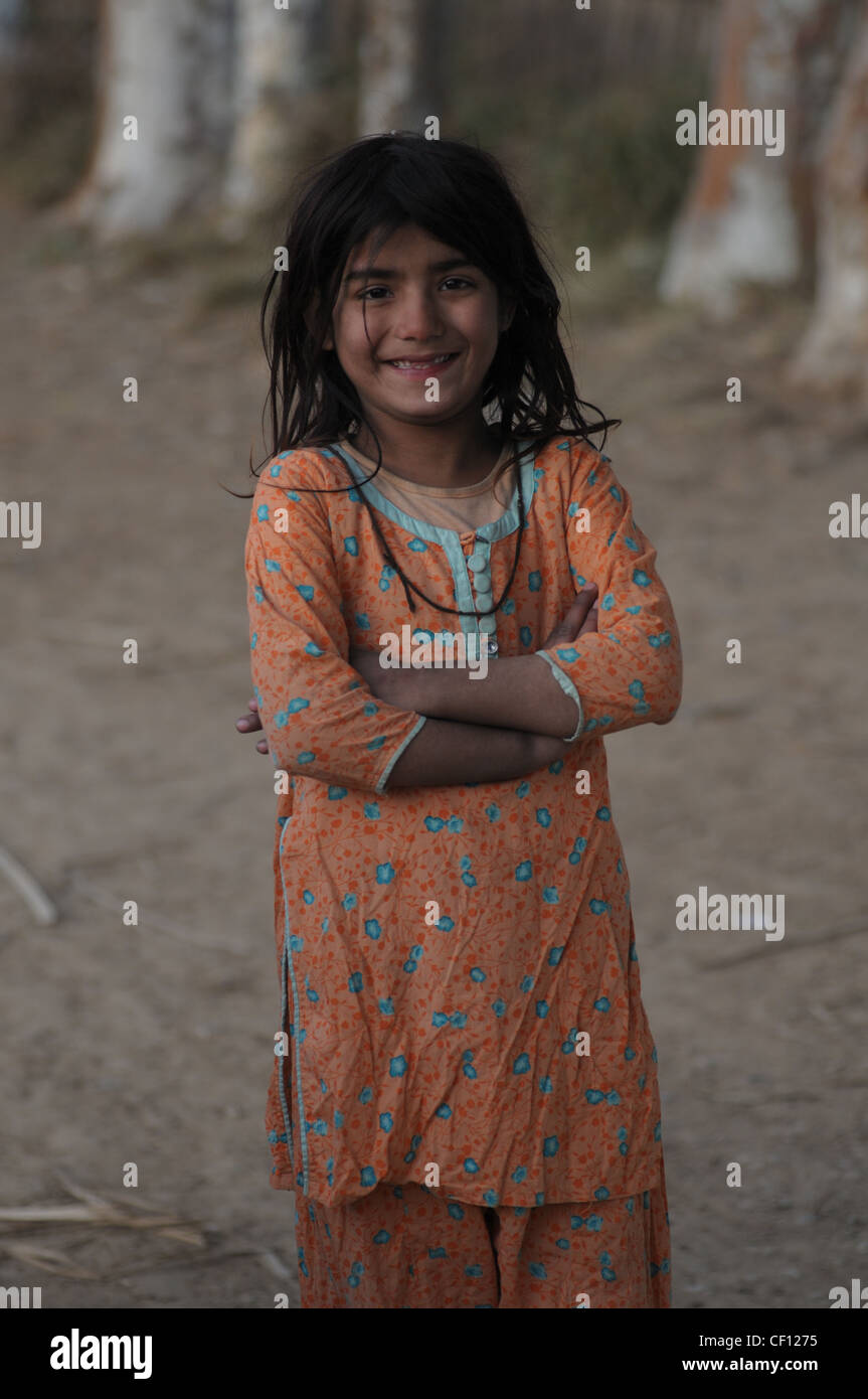 A small girl at the fisherman's village near Fateh Jang, Punjab ...