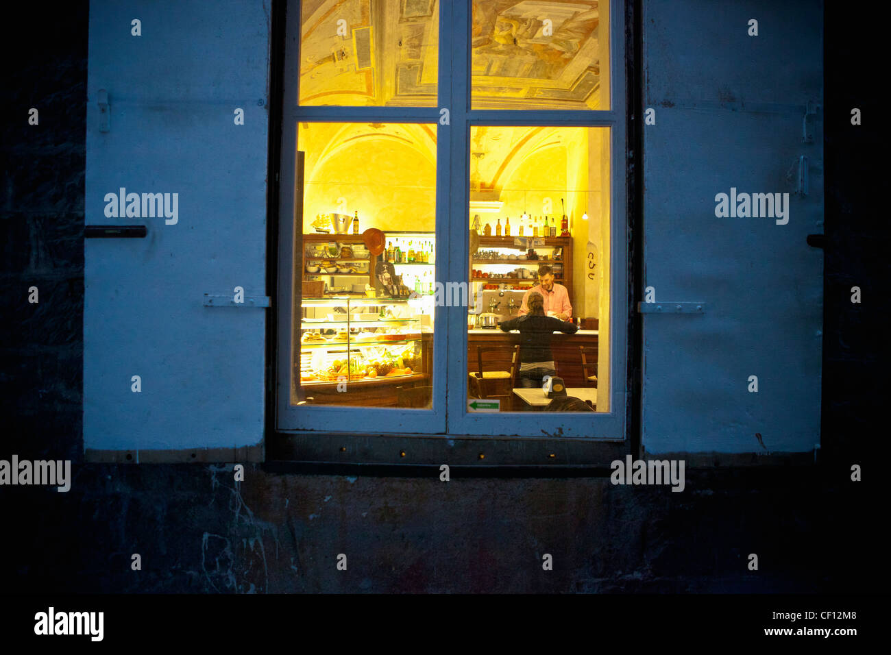 Woman behind window bars hi-res stock photography and images - Alamy