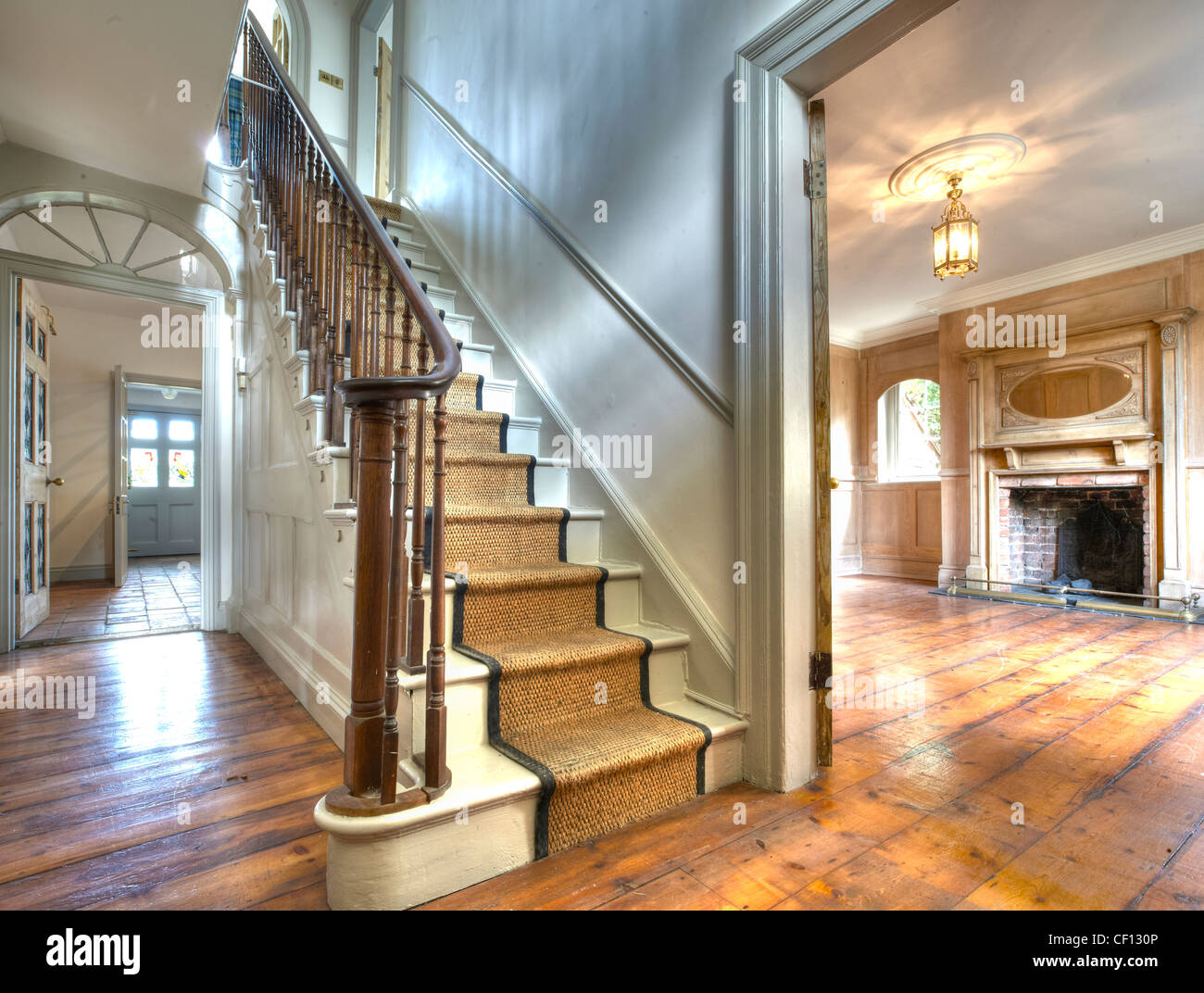 A wide-angle shot of an old but renovated house interior showing a ...