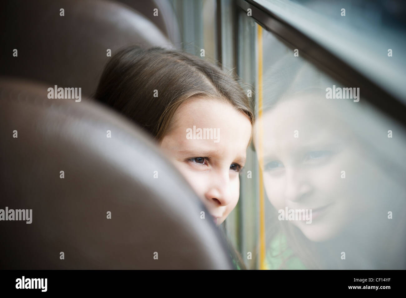 Caucasian girl riding school bus Stock Photo - Alamy