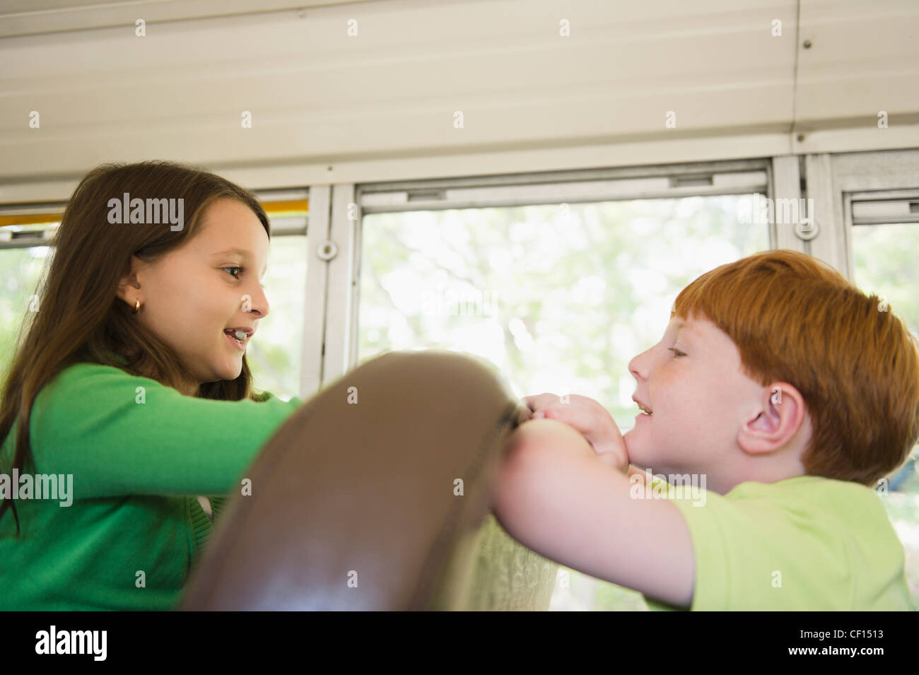 Children riding school bus Stock Photo - Alamy