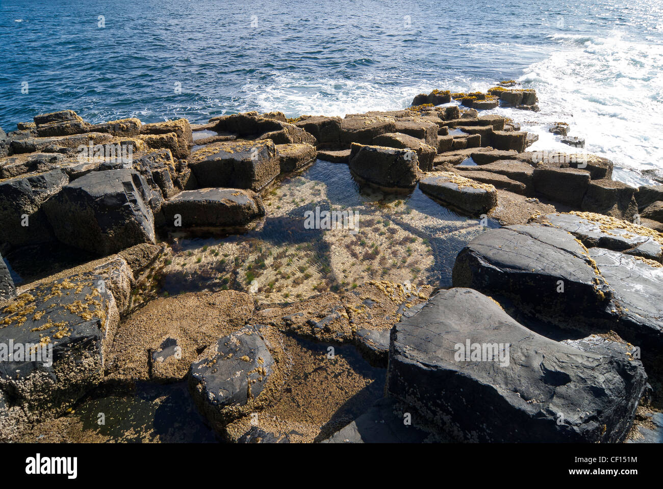 Staffa tertiary basalt steps beside fingals cave Stock Photo - Alamy