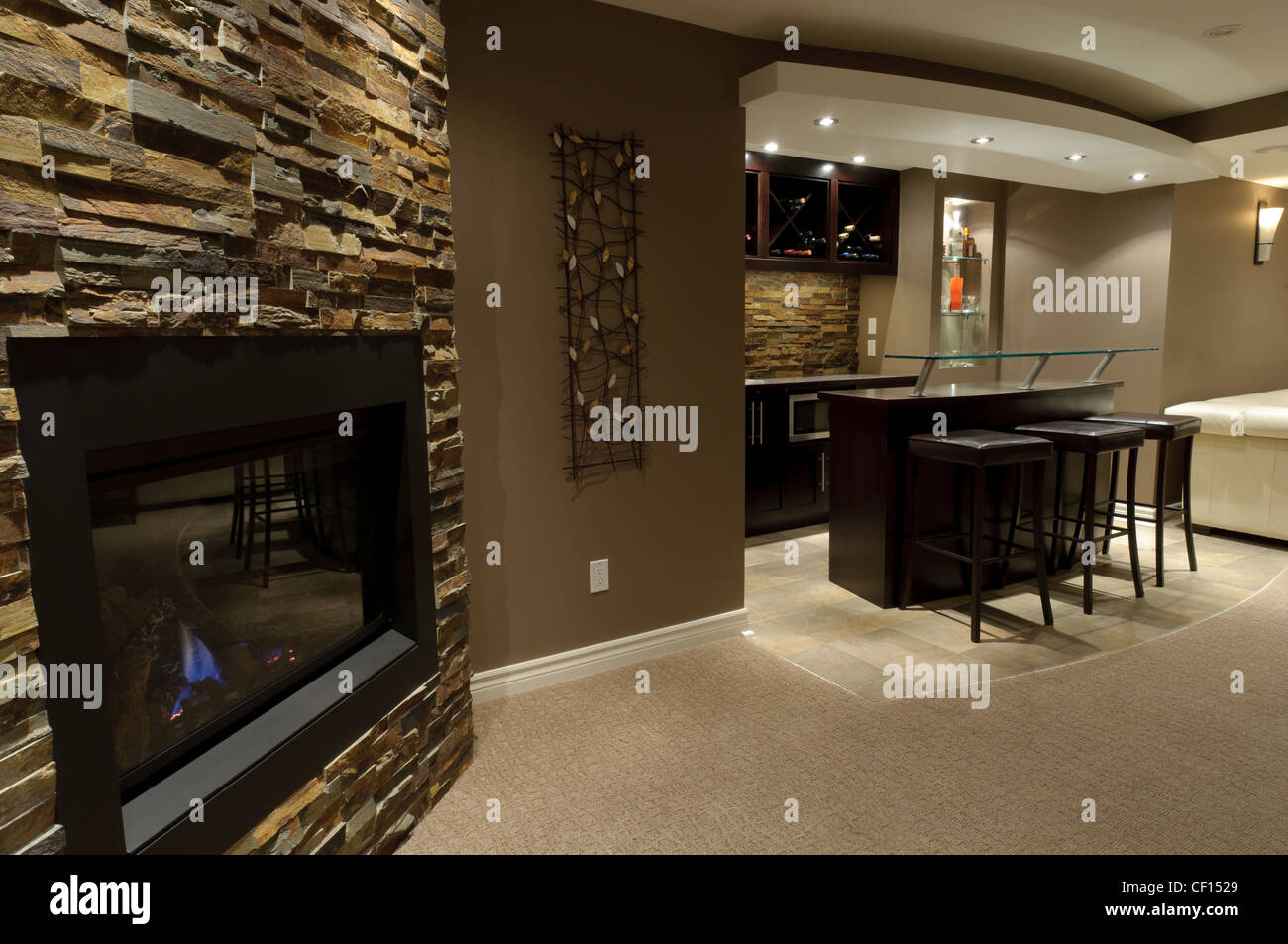 Luxurious residential basement bar with fireplace Stock Photo - Alamy