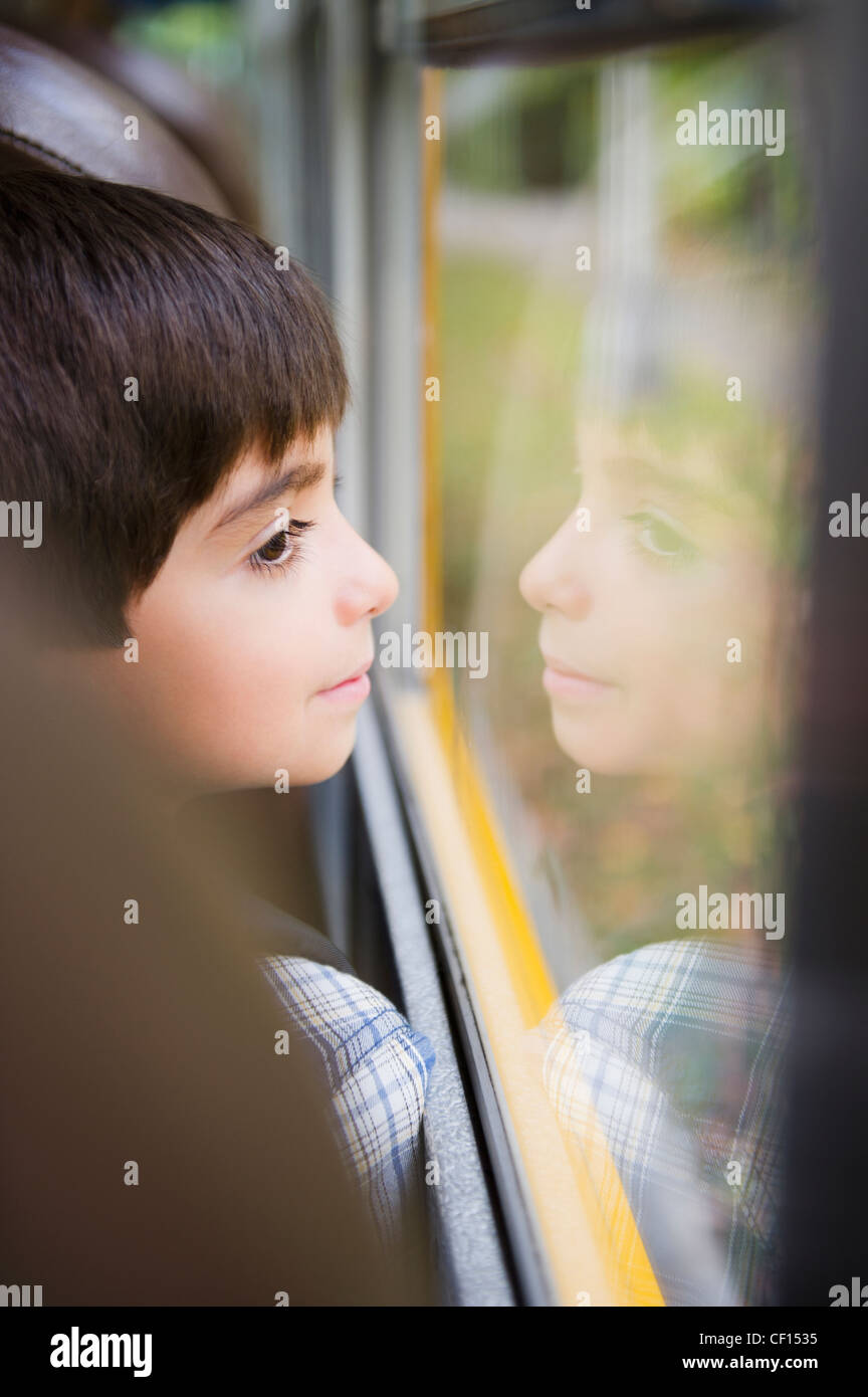 Caucasian boy riding school bus Stock Photo - Alamy