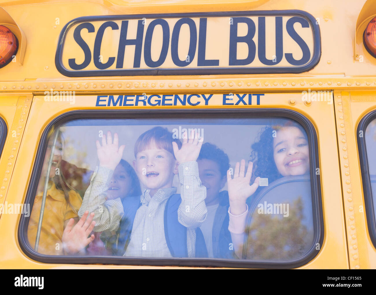 Children riding school bus Stock Photo - Alamy