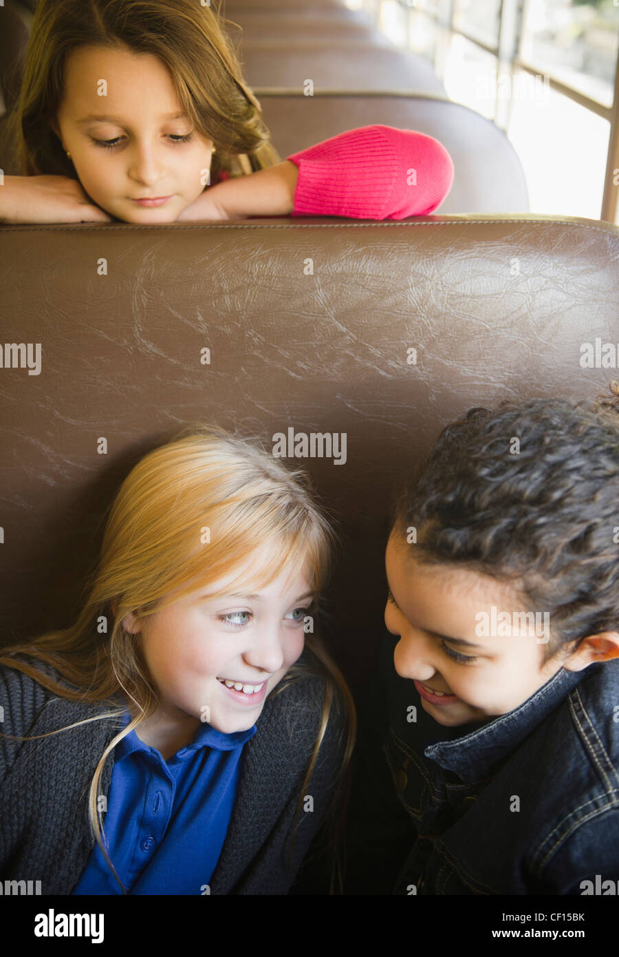 Children riding on school bus Stock Photo - Alamy