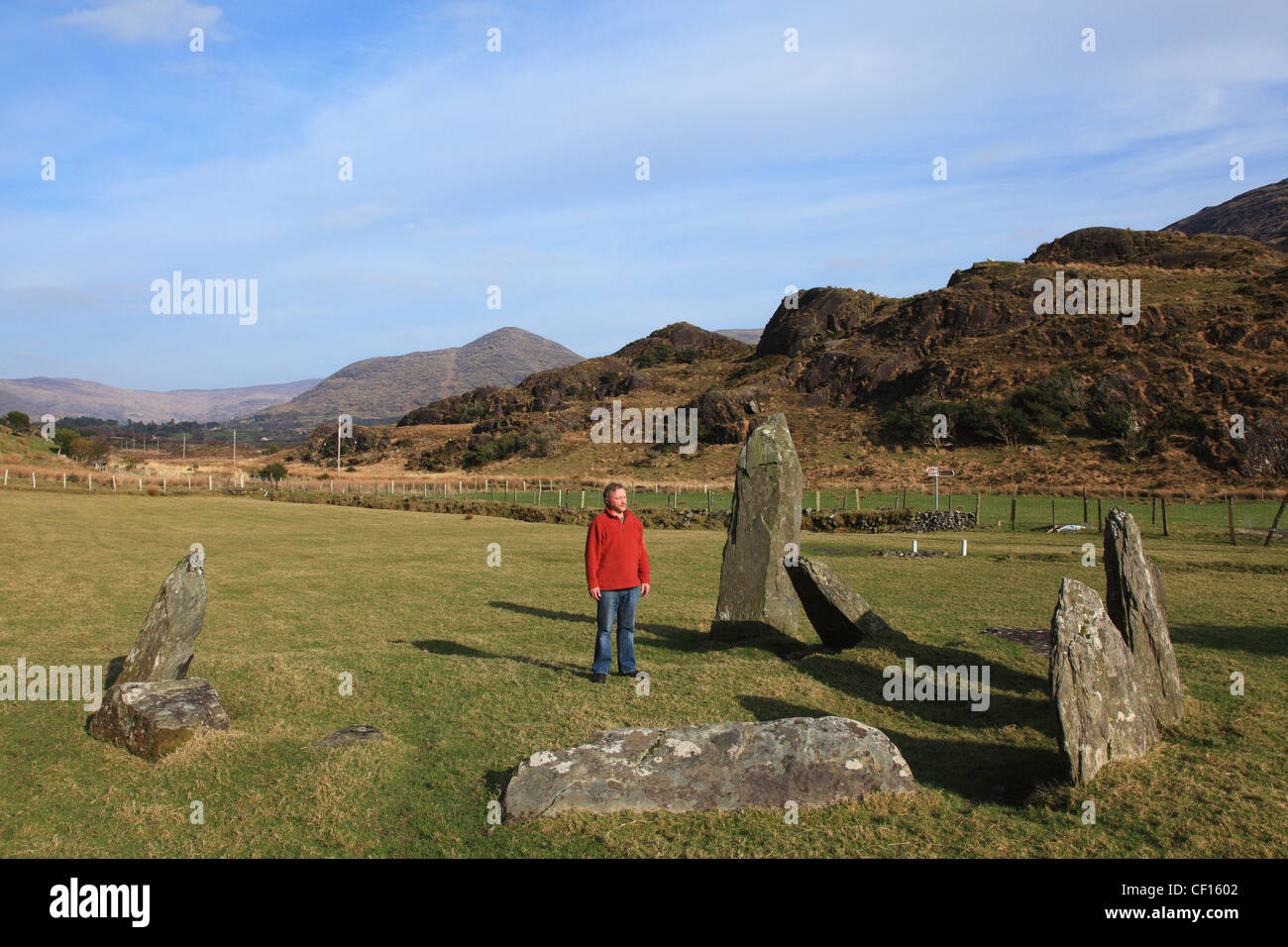 A Man Stands In A Stone Circle; Lauragh County Kerry Ireland Stock ...
