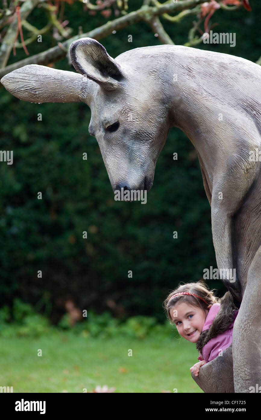 Young girl in the pouch of a model statue of a kangaroo Stock Photo - Alamy