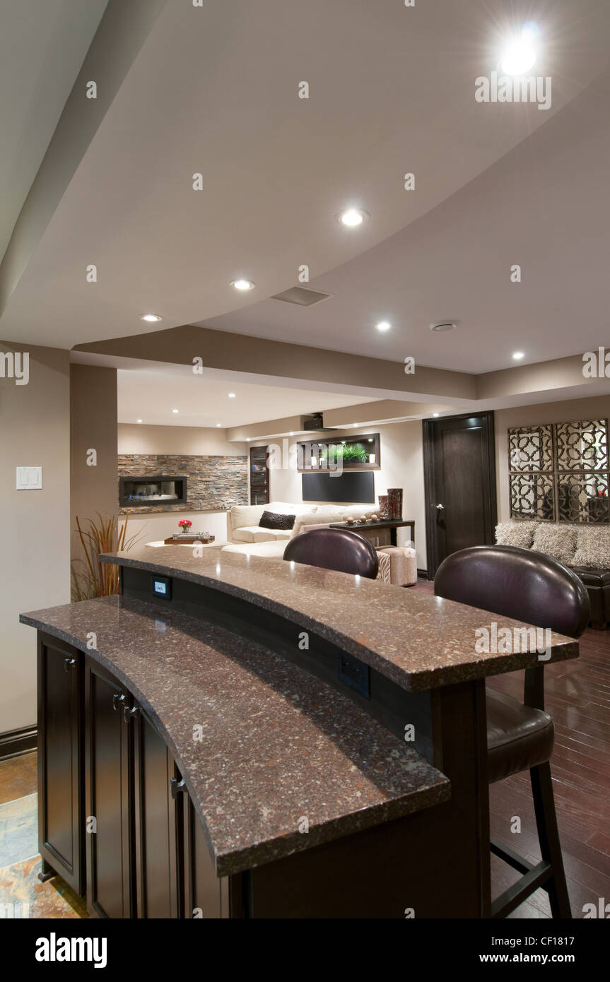 Luxurious residential basement bar with television Stock Photo - Alamy