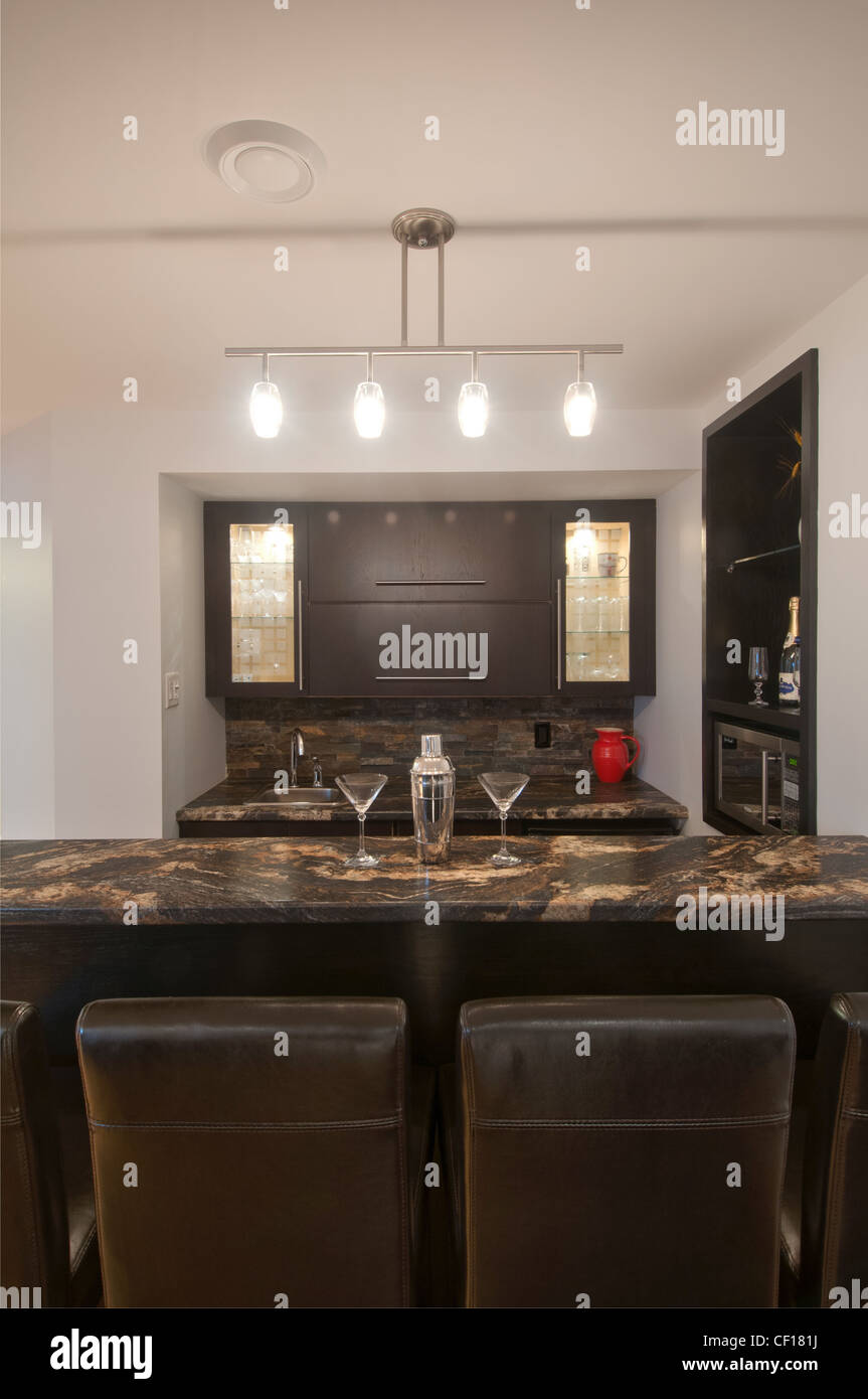 Luxury basement bar with stools and martini glasses Stock Photo - Alamy