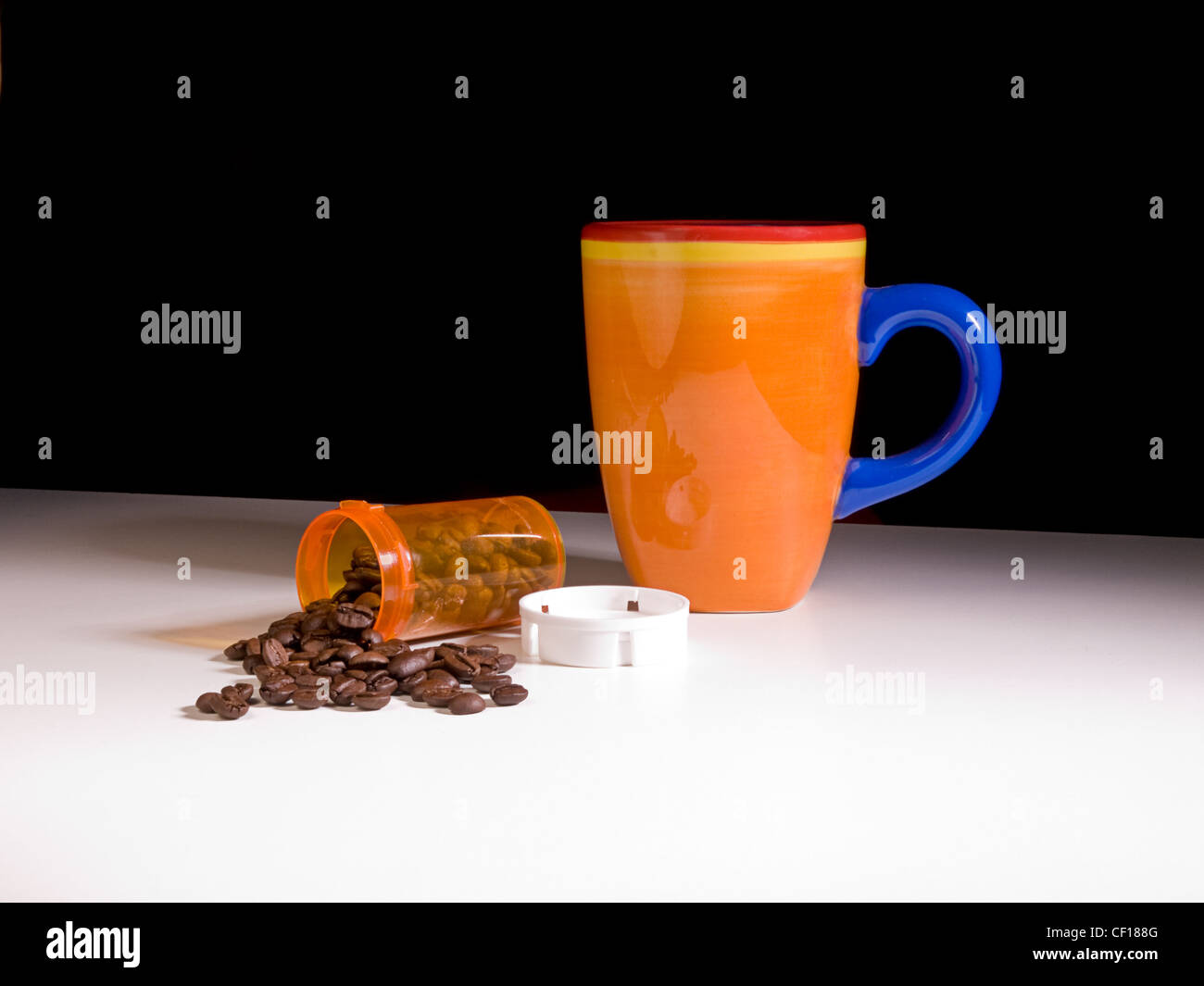 Coffee Addiction - Coffee beans spill from a prescription drug bottle ...