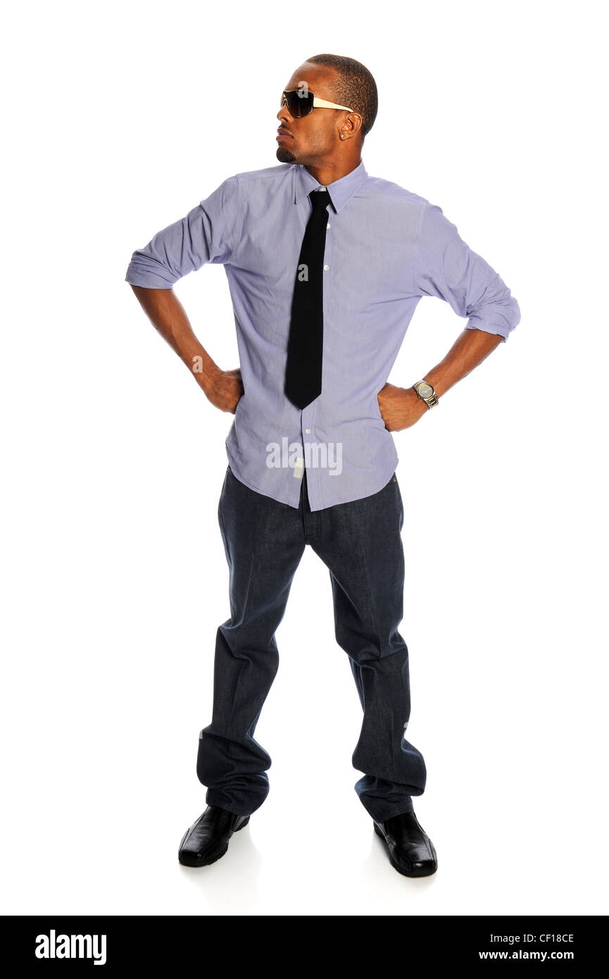 Portrait of African American man standing with hands akimbo isolated ...