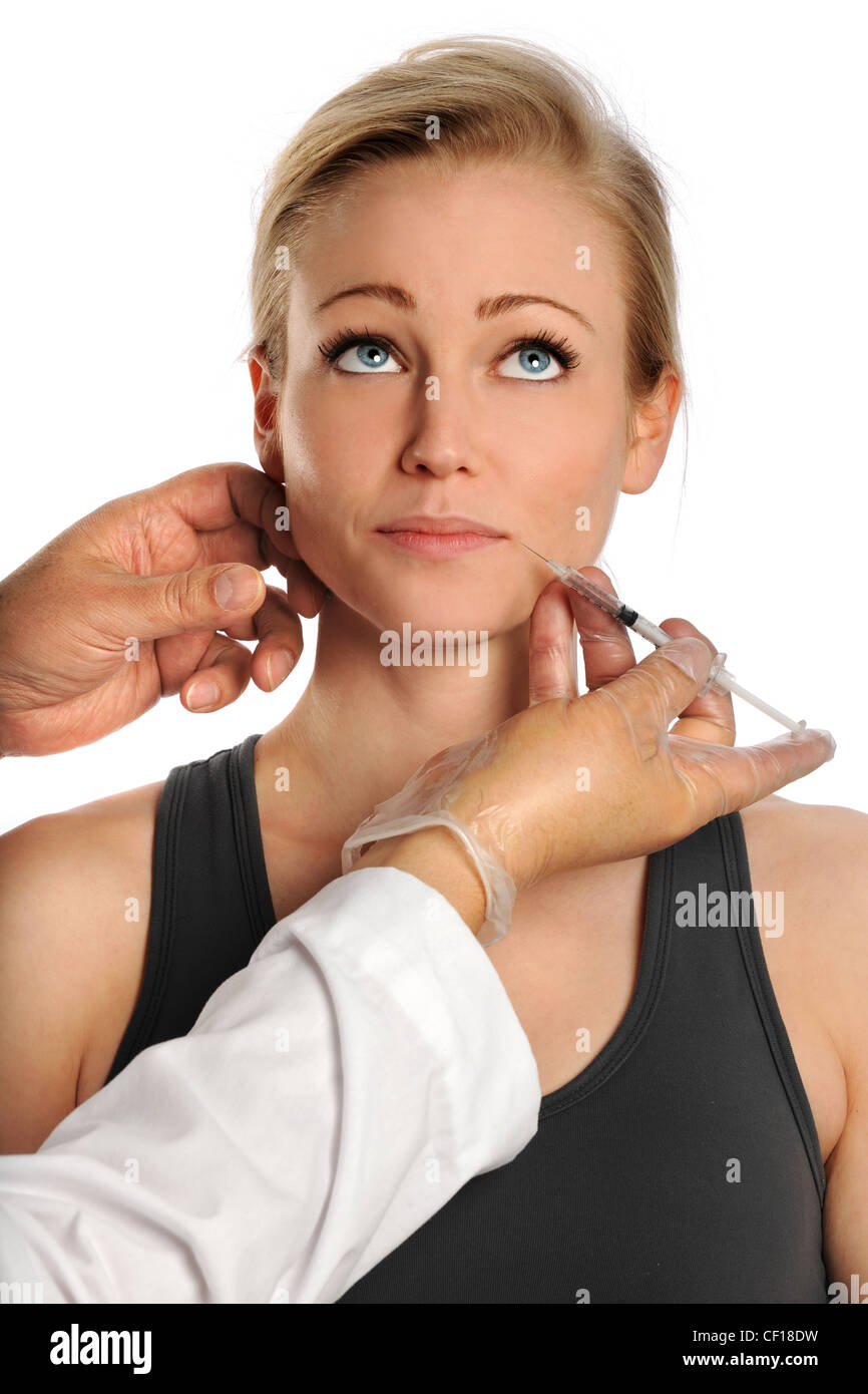 Portrait of woman getting botox injections isolated over white ...