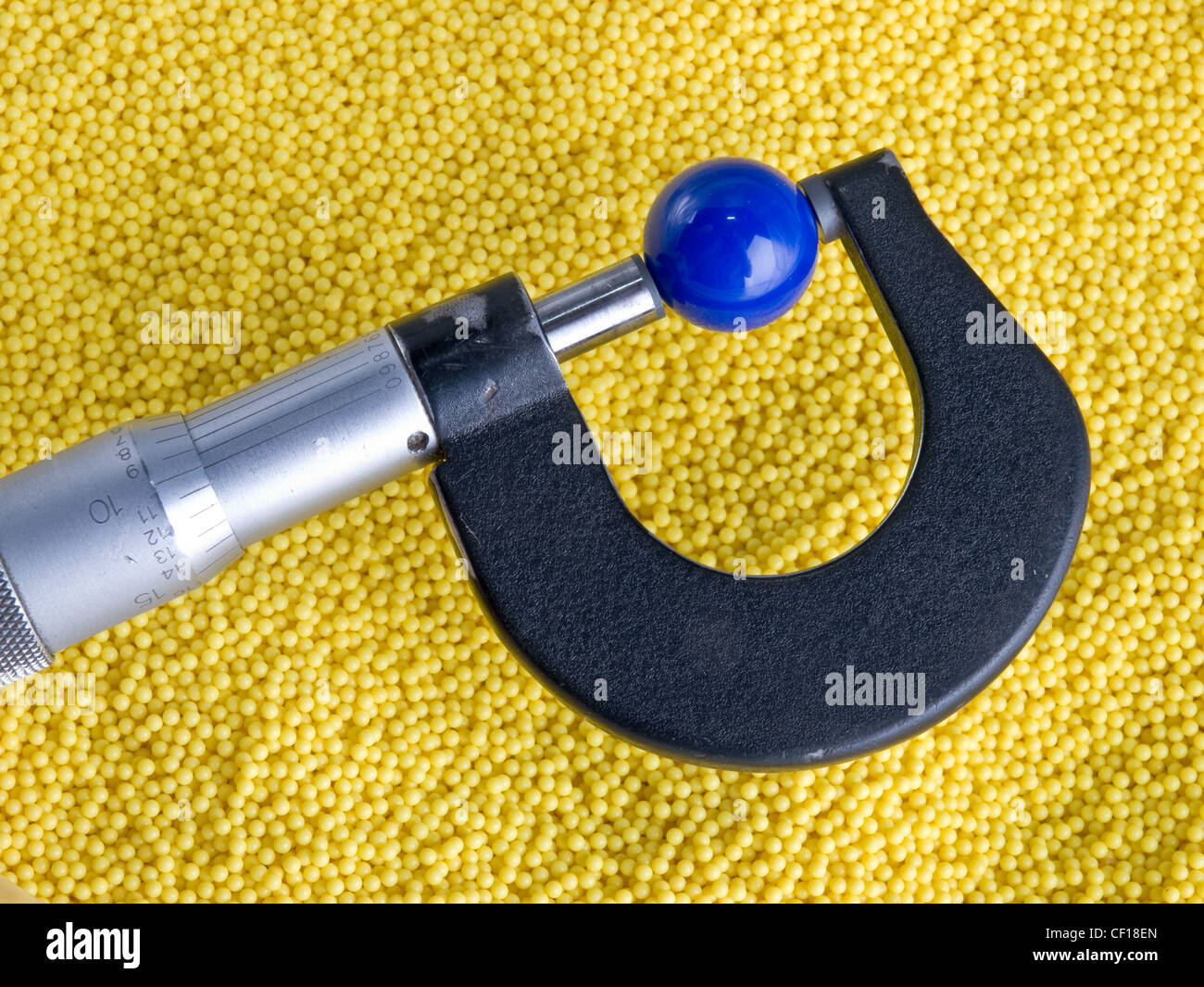 Micrometer with Beads and Balls. Plastic colorful beads and a ...