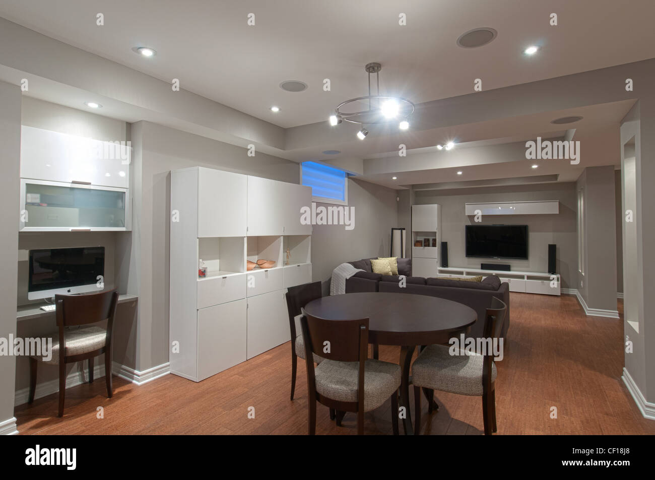 Luxury residential basement lving room with flat screen television ...