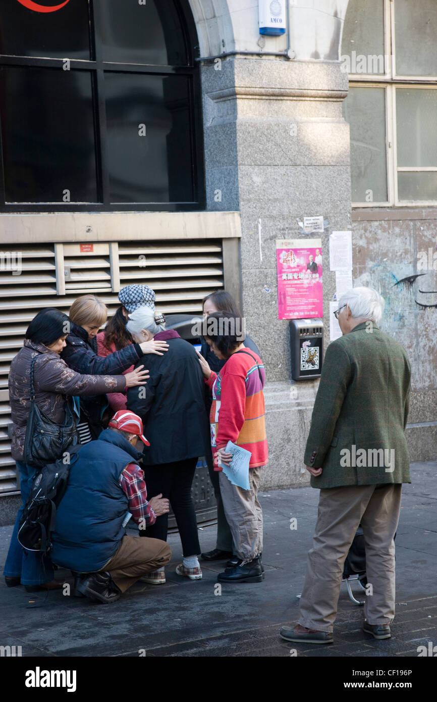 Chinese people in group hug, Chinatown, London Stock Photo - Alamy