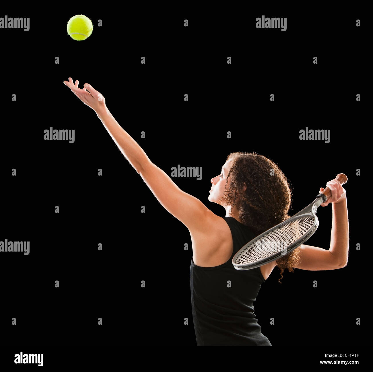 Caucasian tennis player serving the ball Stock Photo - Alamy