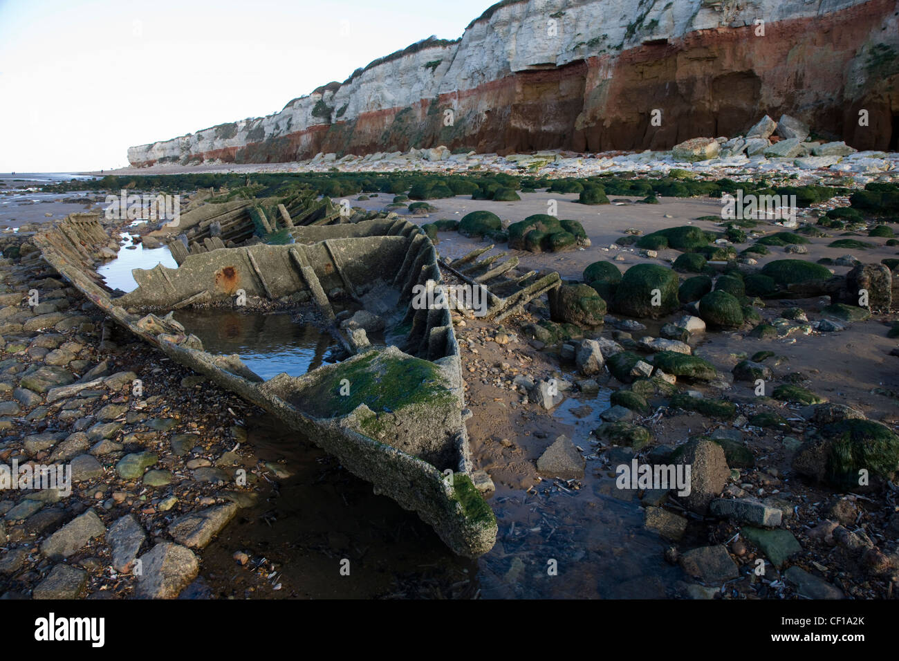 Cliffs made of red and white layered sedimentary rock with horizontal ...