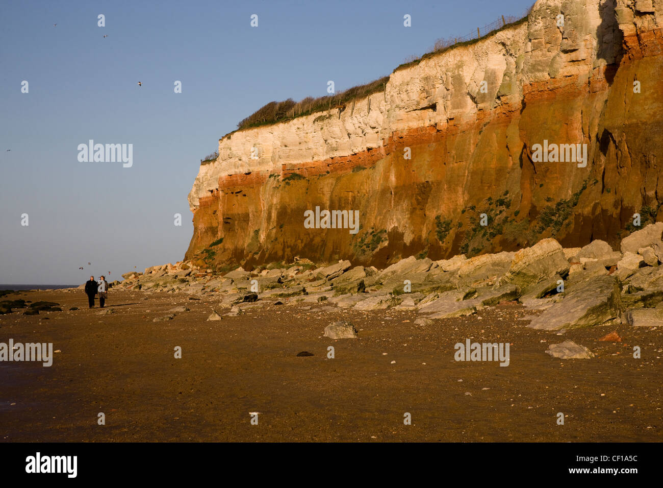 Cliffs made of red and white layered sedimentary rock with horizontal ...