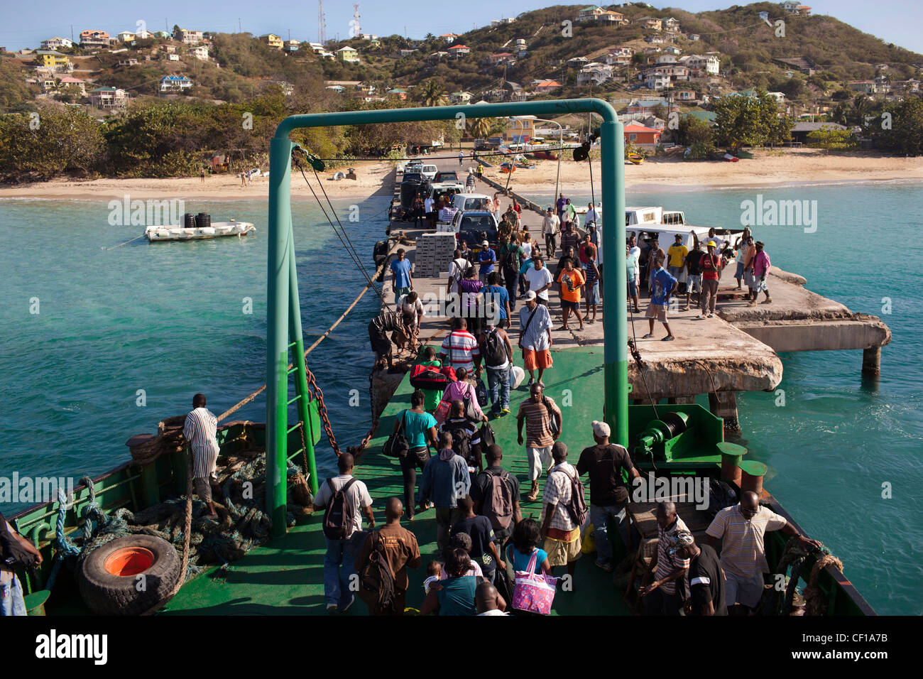 Traveling from St. Vincent, passengers disembark the Barracuda ...