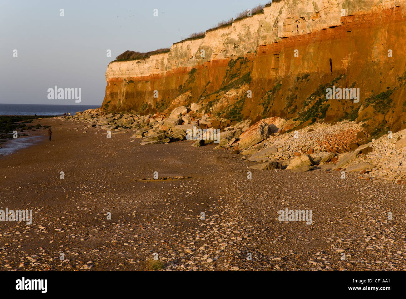 Cliffs made of red and white layered sedimentary rock with horizontal ...