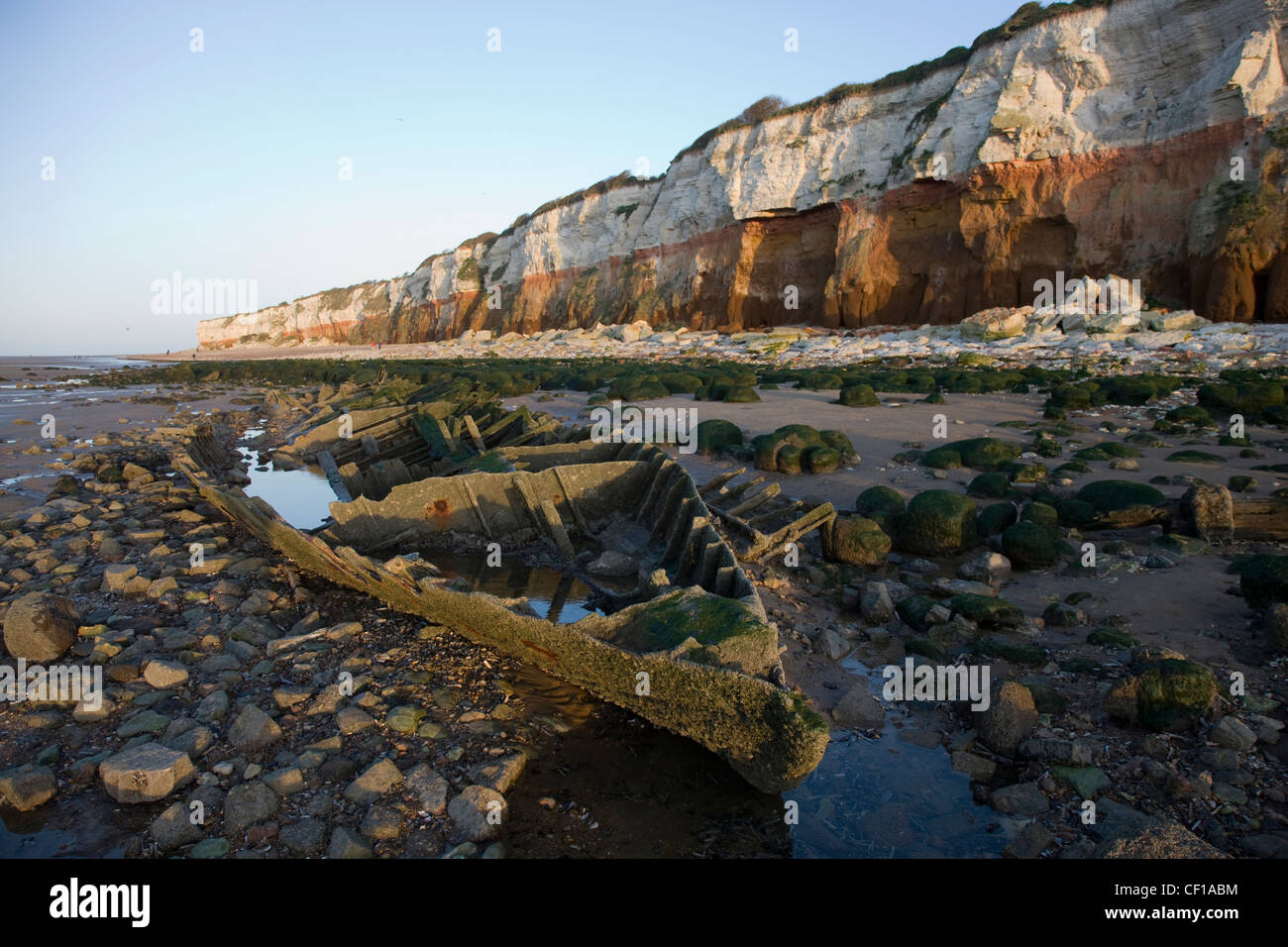 Cliffs made of red and white layered sedimentary rock with horizontal ...
