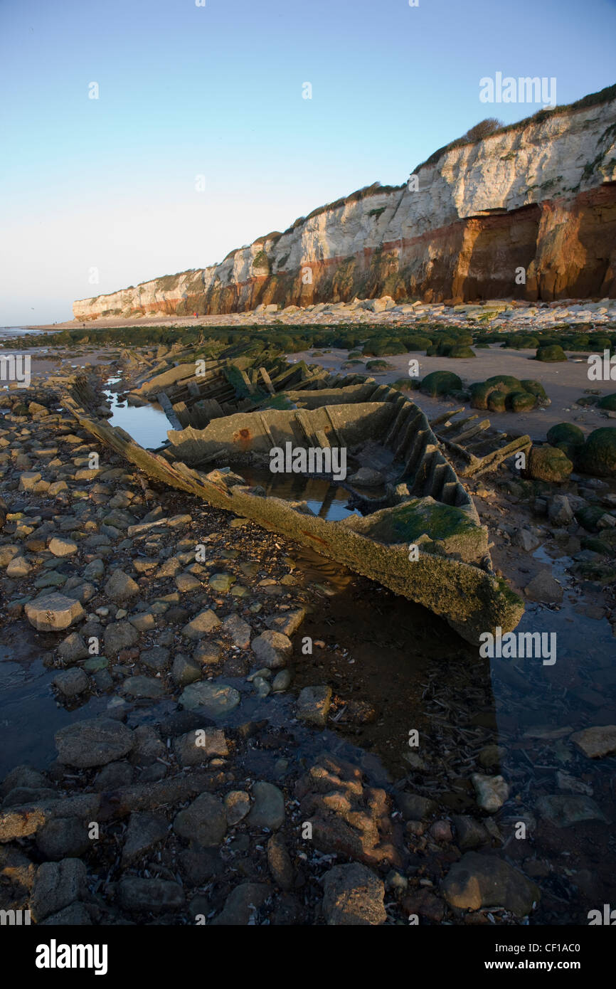Cliffs made of red and white layered sedimentary rock with horizontal ...