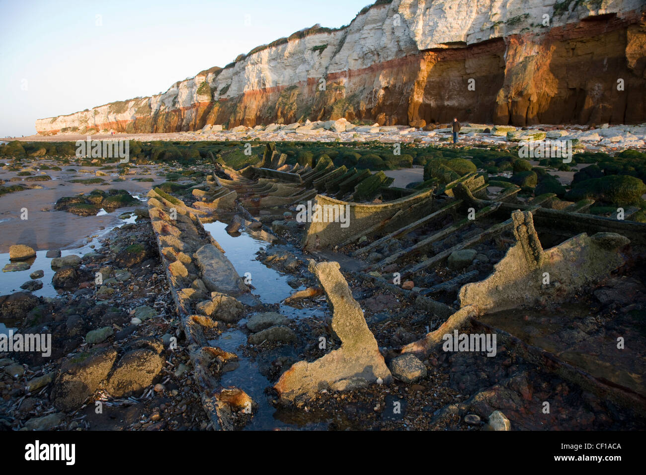 Cliffs made of red and white layered sedimentary rock with horizontal ...