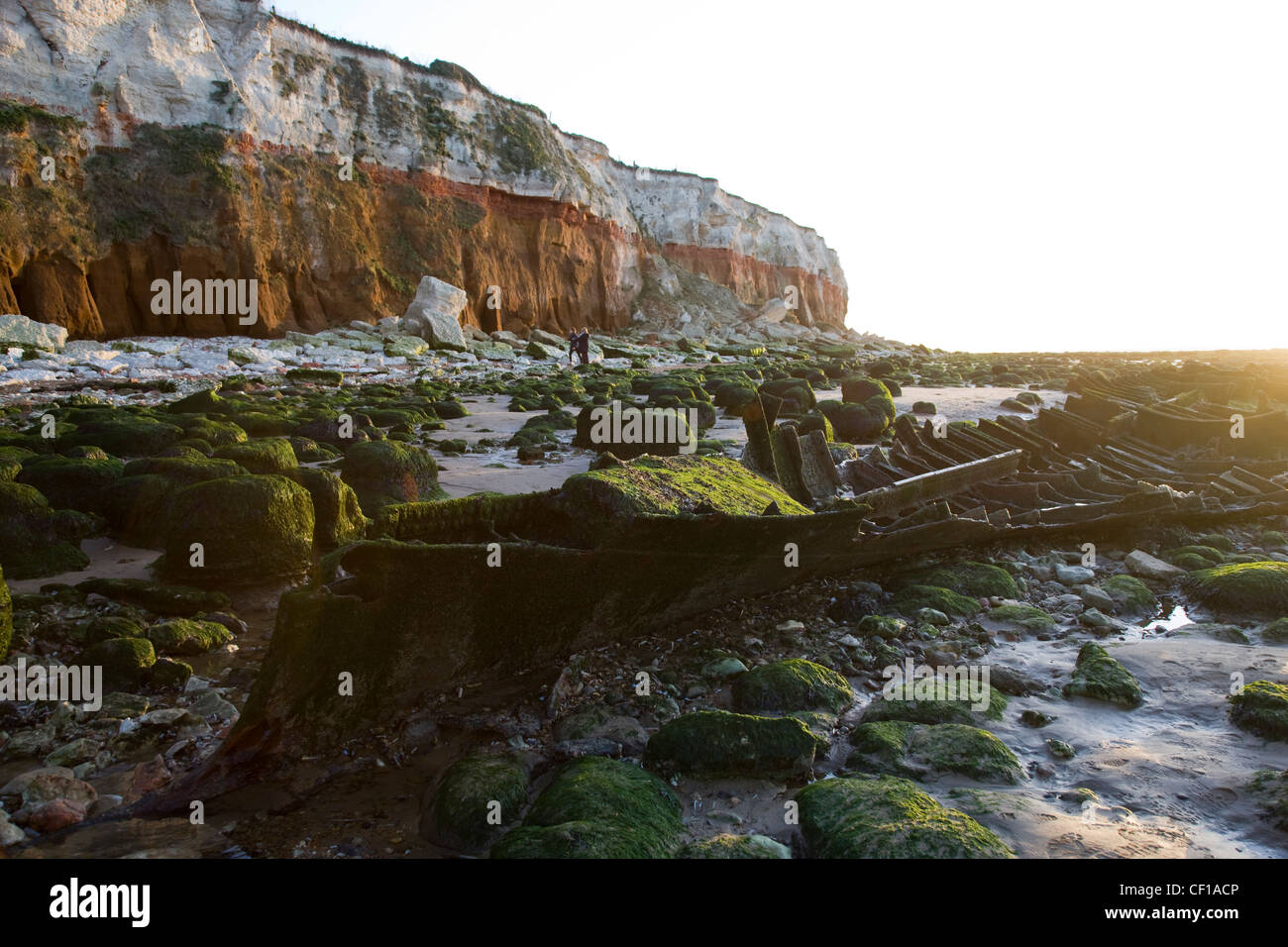 Cliffs made of red and white layered sedimentary rock with horizontal ...
