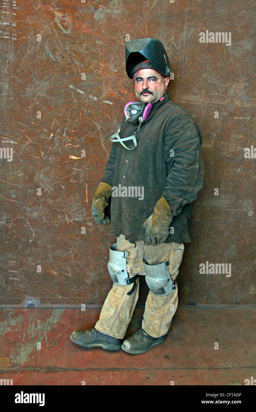 Tug boat repair man Stock Photo - Alamy