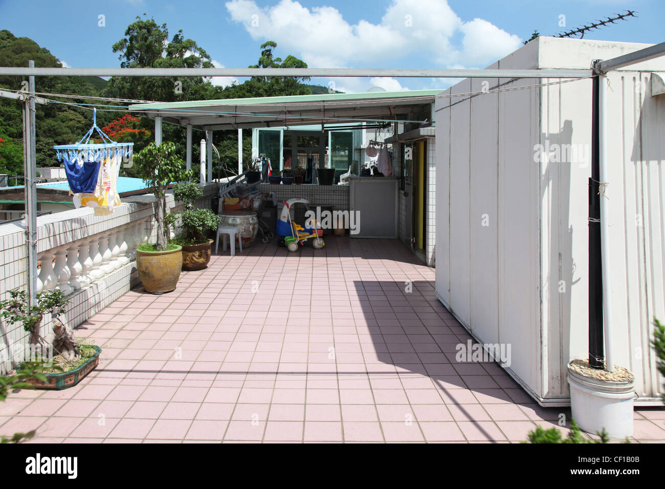 It's a roof terrace with an extra storage room. Sunny day. Forest ...