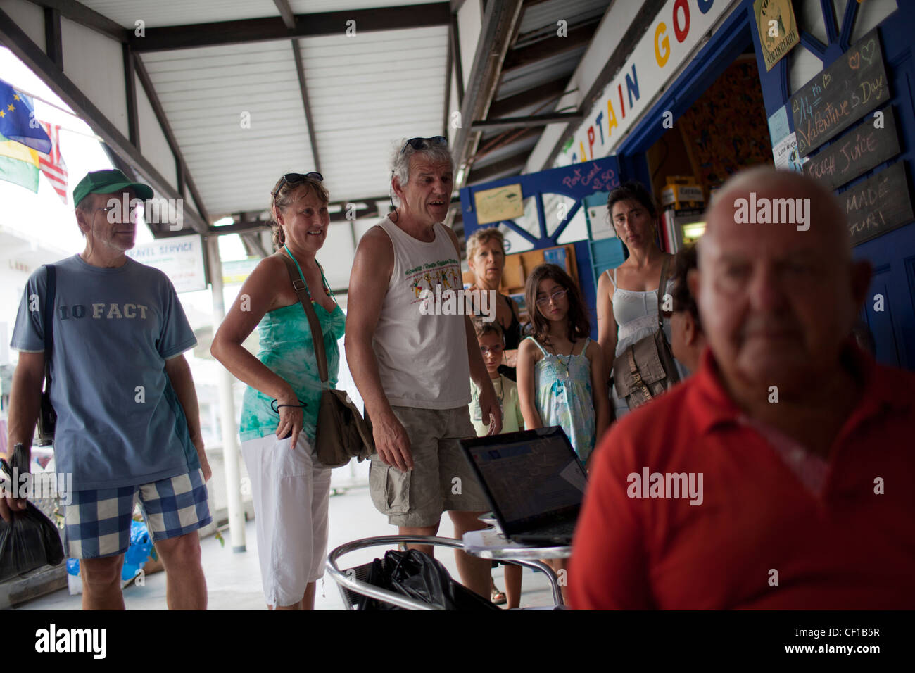 French tourists, standing, and foreign residents gather at a local cafe ...