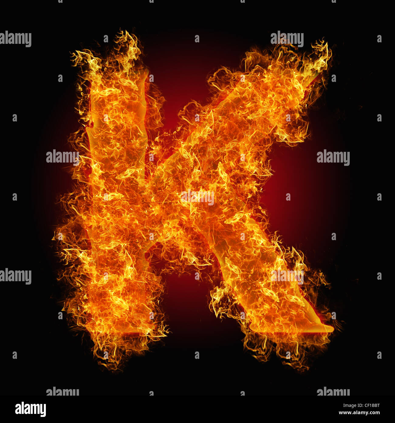 Fire letter K on a black background Stock Photo - Alamy