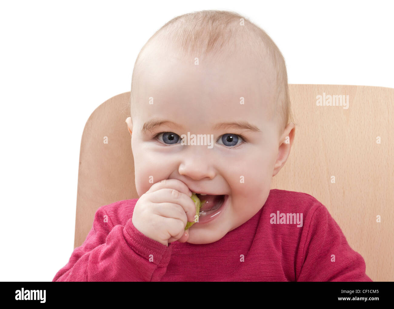 child in red shirt eating. white background Stock Photo - Alamy