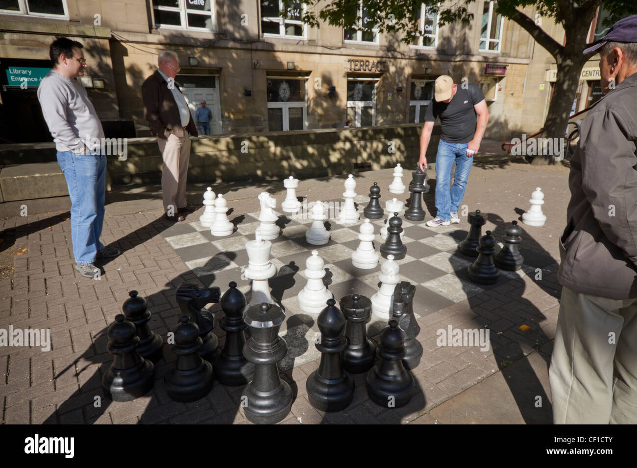 Men playing chess outside Leeds Library, The Headrow, Leeds city centre ...