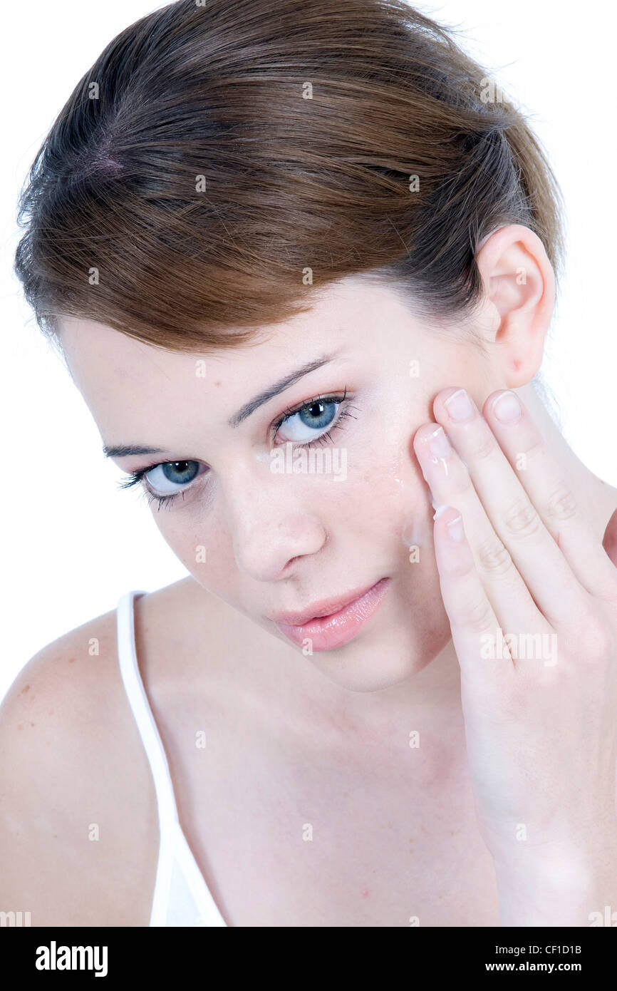 Female with her hand on the side of her face Stock Photo - Alamy